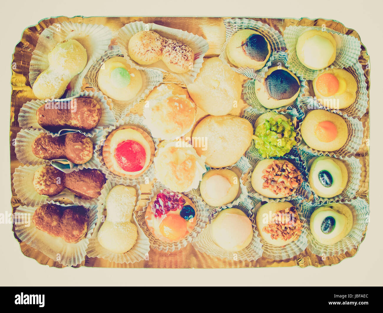 Vintage retro looking Mixed pastries with chocolate, cream, fruit ...