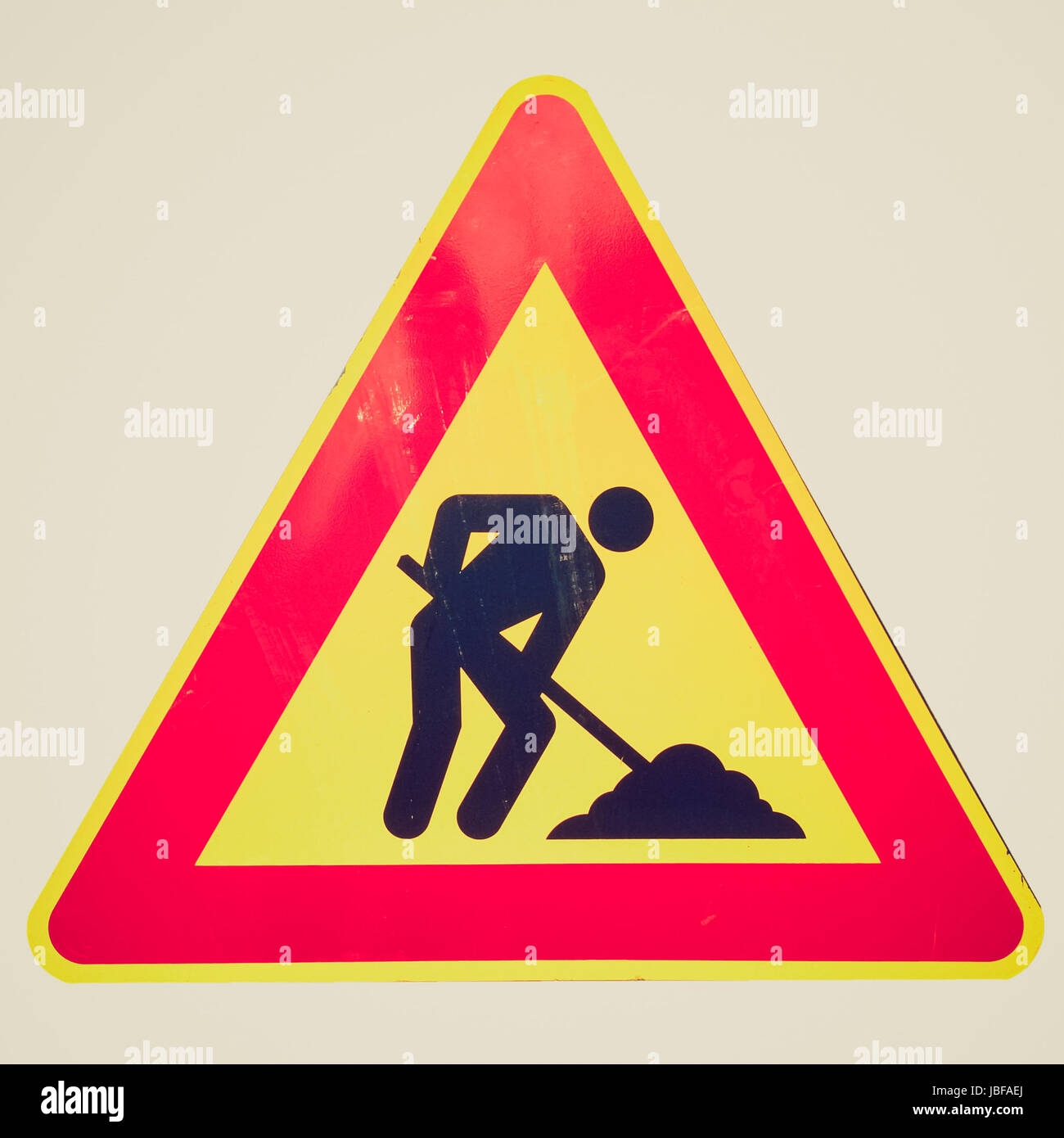 Vintage retro looking Road work sign isolated over a white background ...