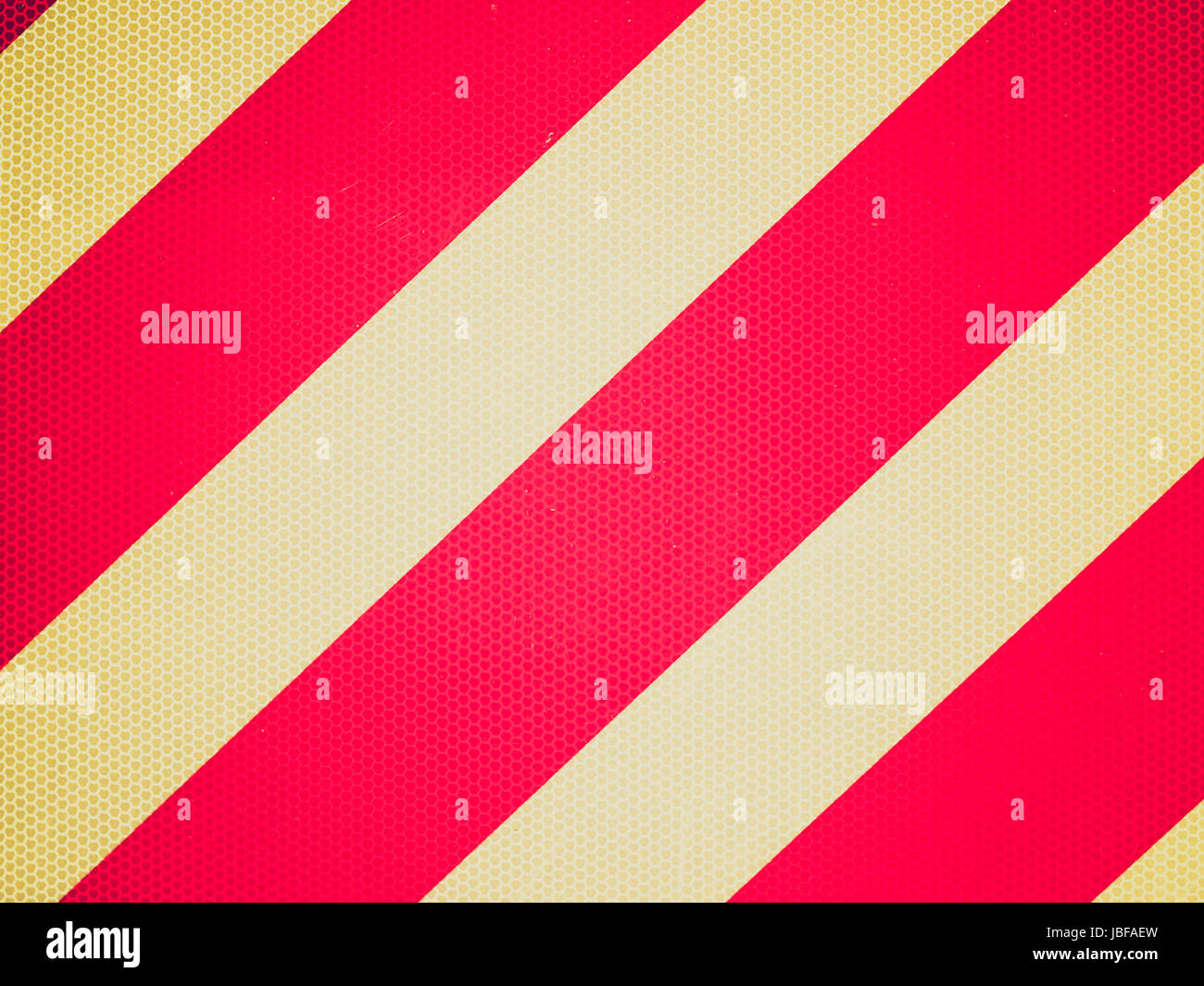 Vintage retro looking Reflective red and white stripes on a traffic ...