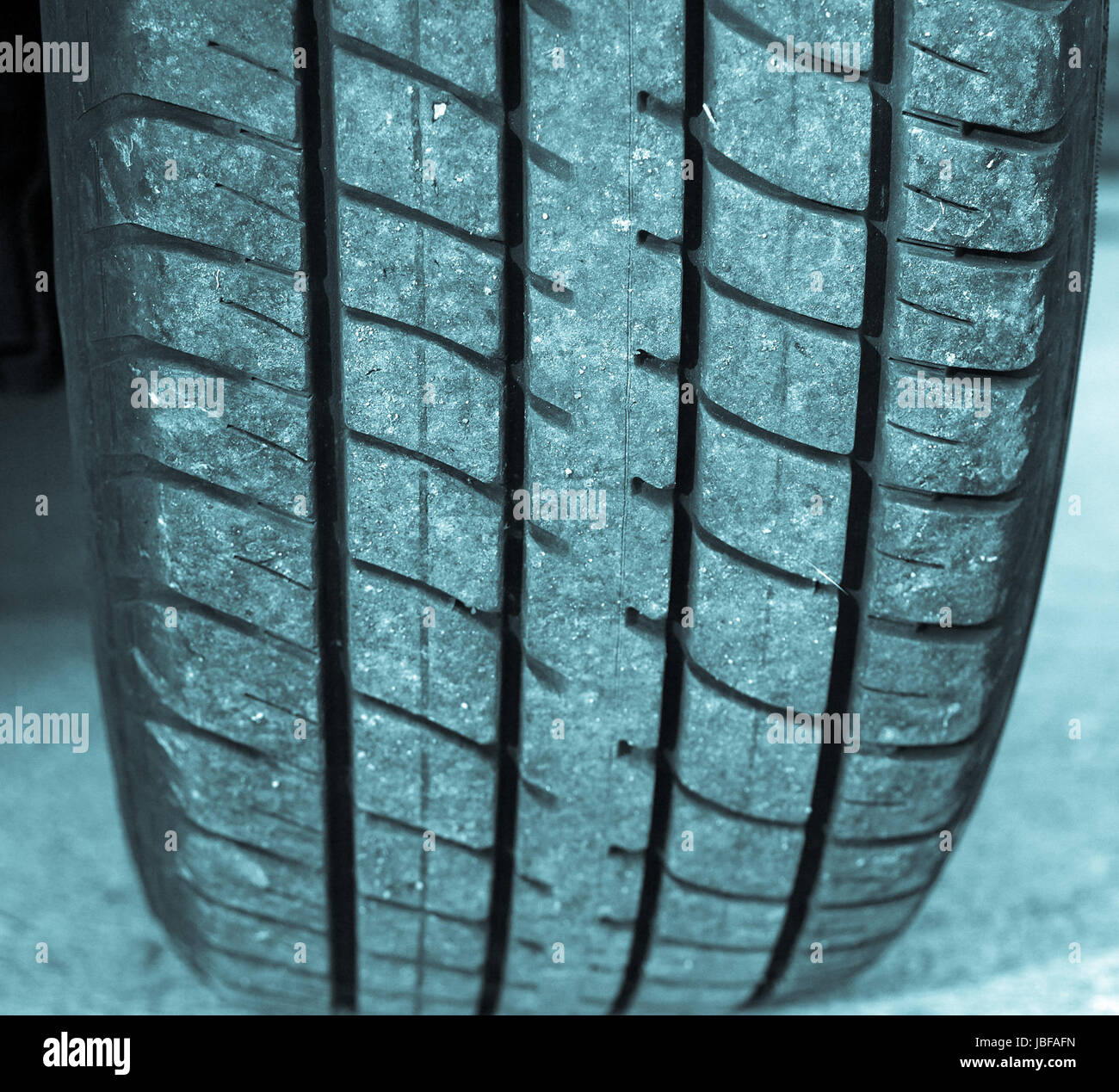 Detail close up of car wheel tyre - cool cyanotype Stock Photo - Alamy