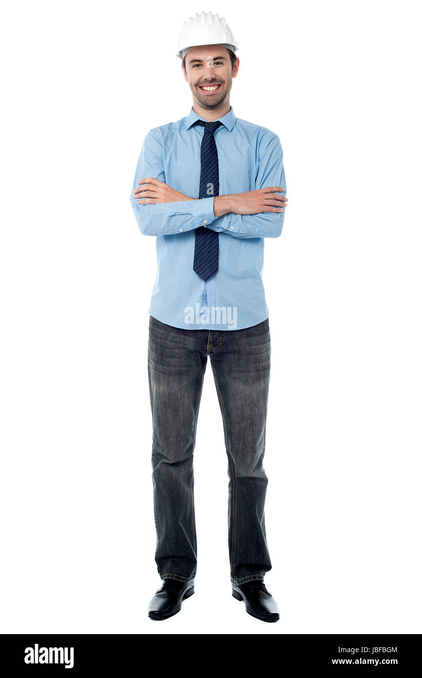 Young mechanical engineer posing over white Stock Photo - Alamy
