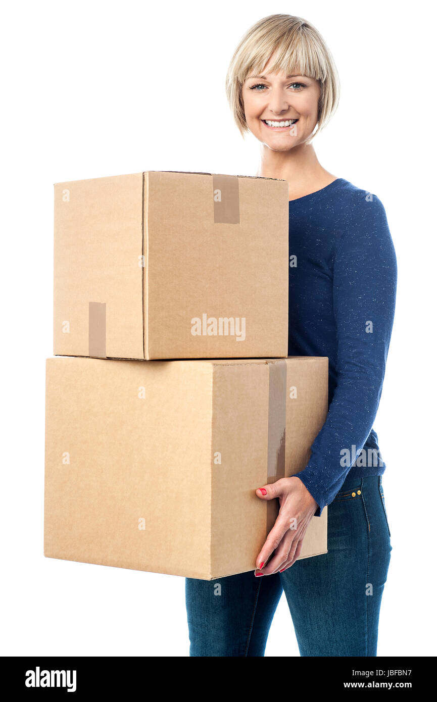 Cheerful woman posing with two packed boxes Stock Photo - Alamy
