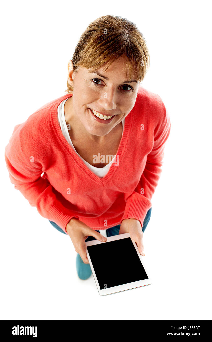 Pretty lady holding new tablet pc, aerial shot Stock Photo - Alamy