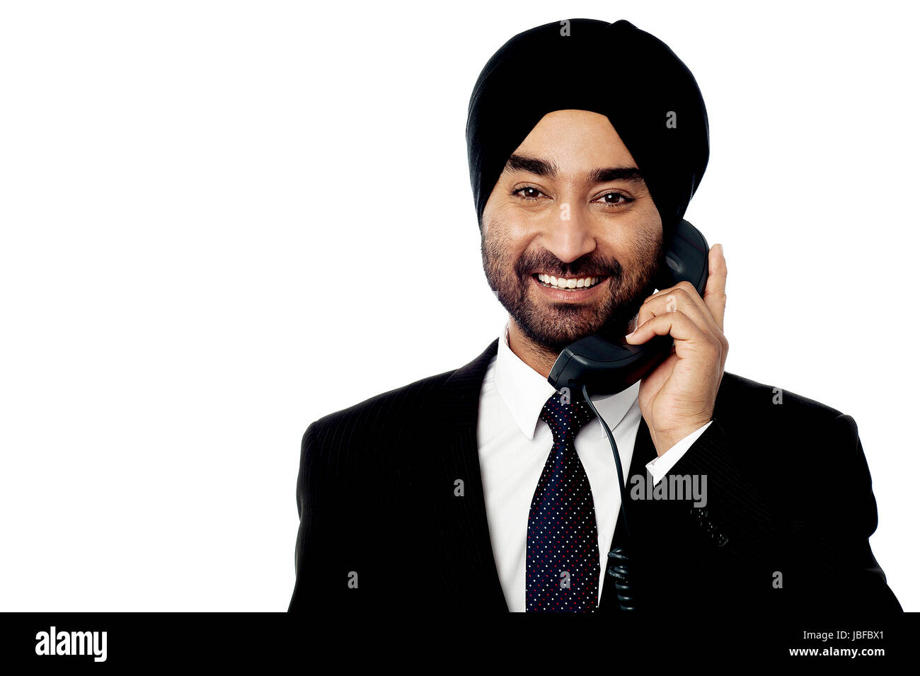 Handsome indian male executive attending call Stock Photo - Alamy
