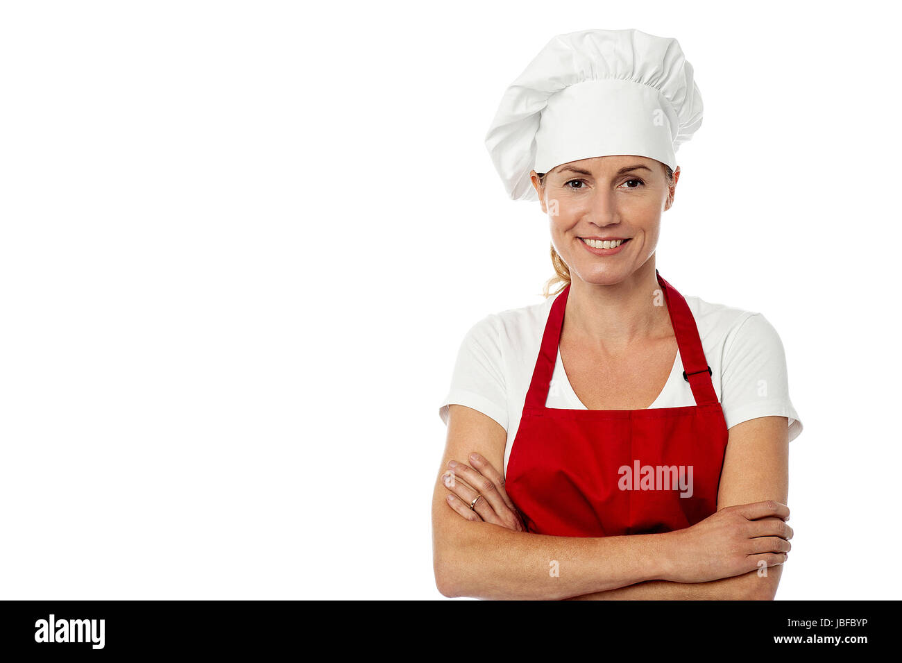 Charming female chef wearing red apron and toque Stock Photo - Alamy