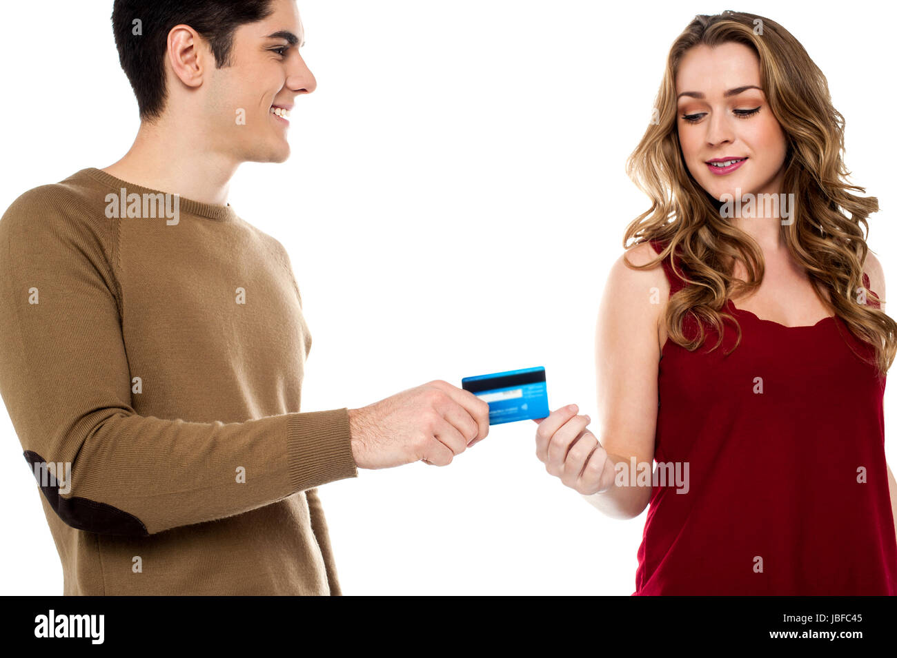 Young guy giving credit card to his girlfriend Stock Photo - Alamy