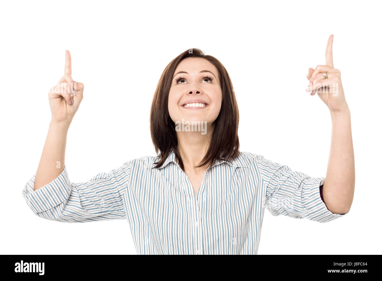 Pretty woman looking and pointing upwards Stock Photo - Alamy