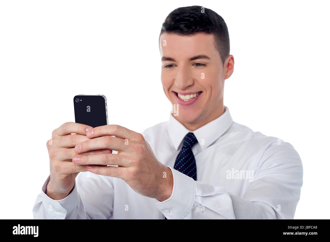 Corporate guy sending text message Stock Photo - Alamy