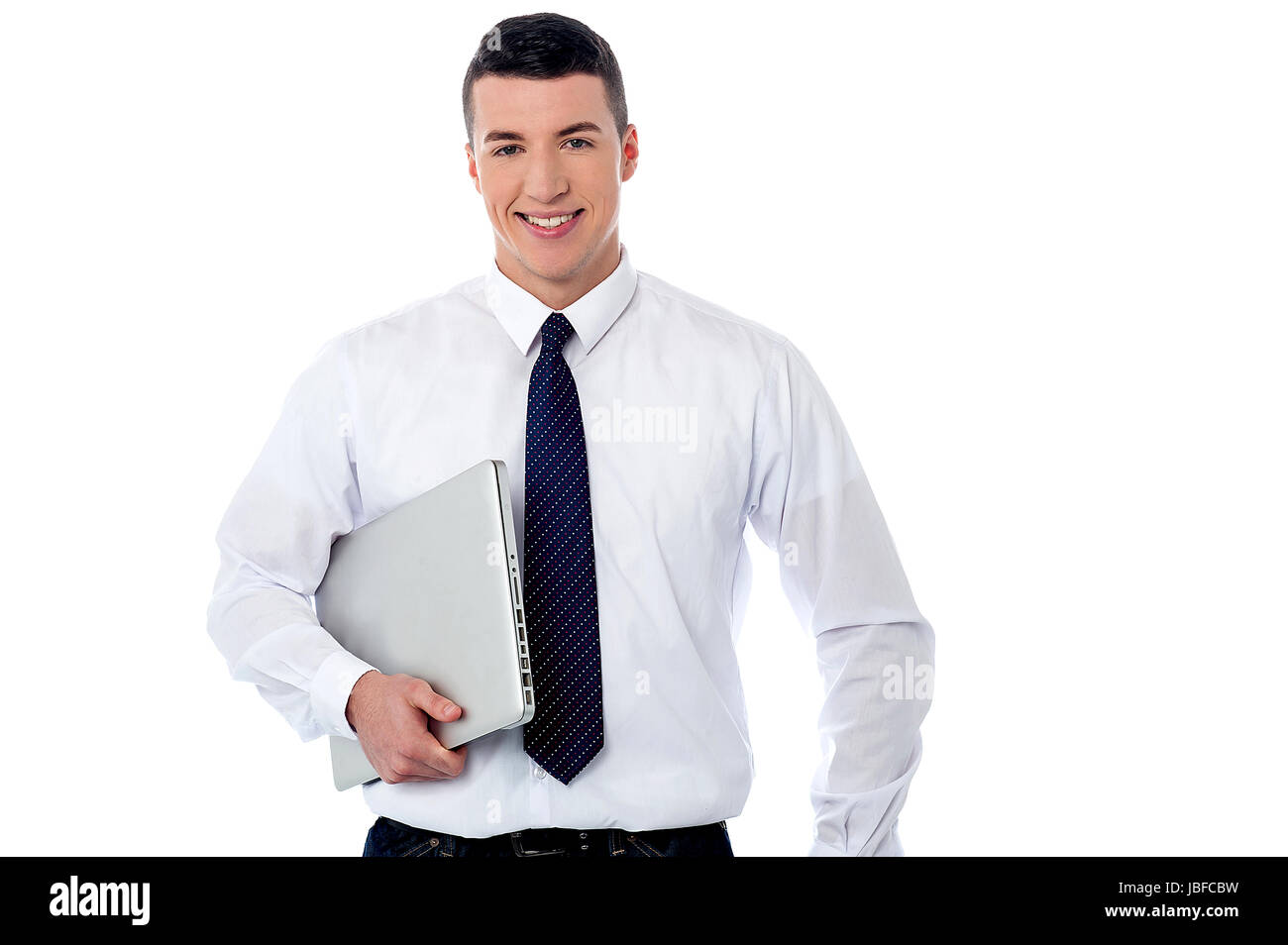 Handsome smiling businessman holding laptop Stock Photo - Alamy