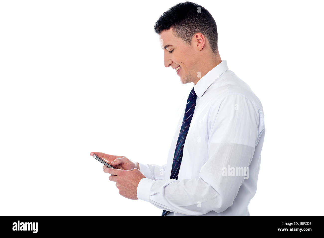 Corporate guy sending text message Stock Photo - Alamy