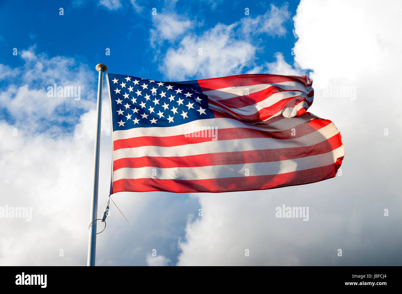 american flag blowing in the wind Stock Photo - Alamy