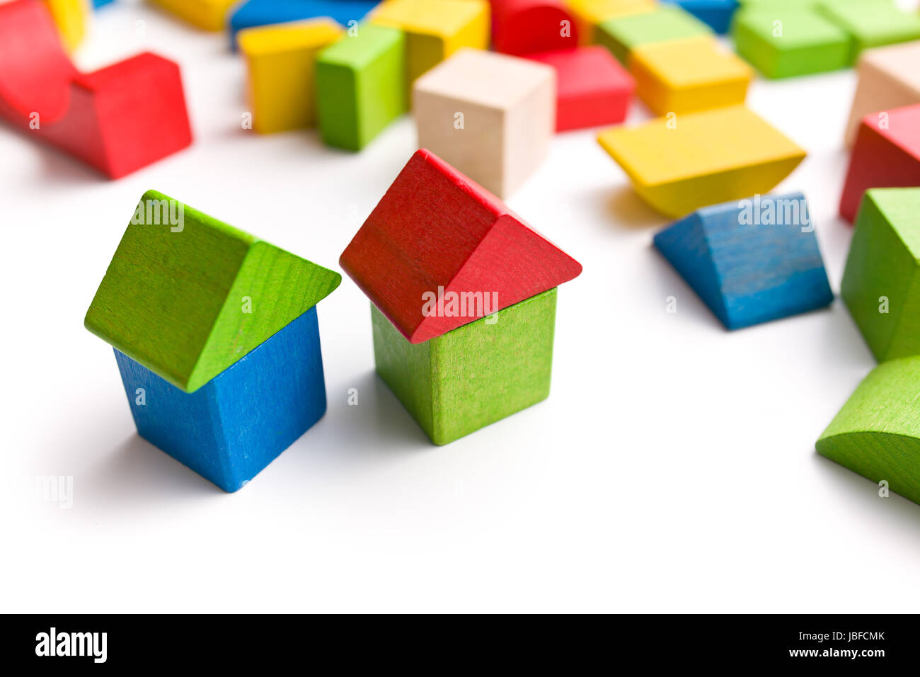 house made from wooden toy blocks on white background Stock Photo - Alamy