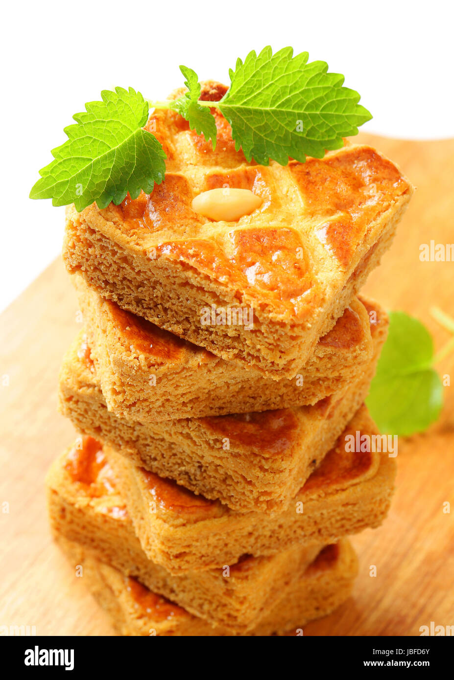 Small square cakes filled with thick almond paste Stock Photo - Alamy