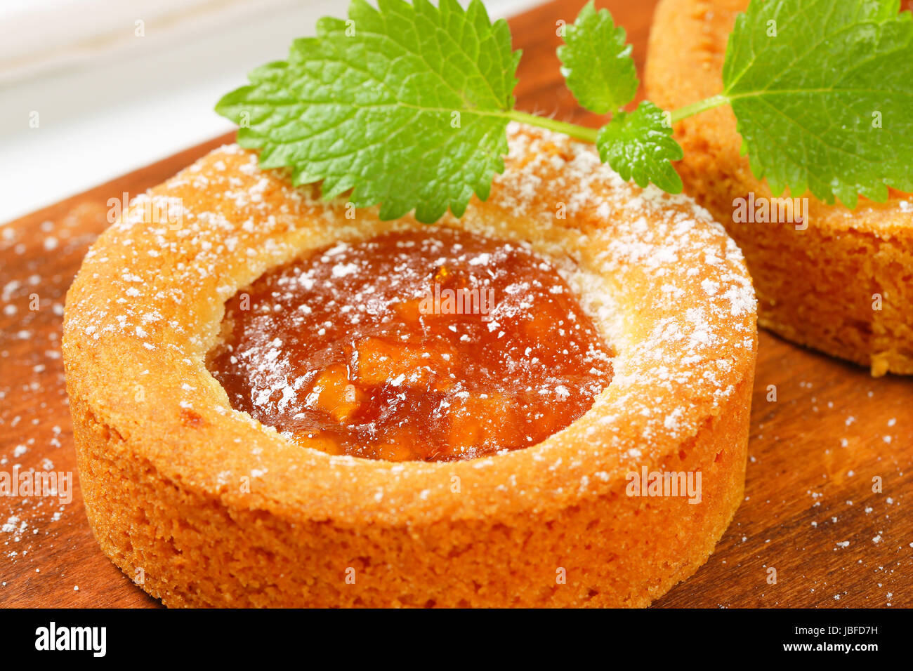 Small round cakes filled with apple puree Stock Photo - Alamy