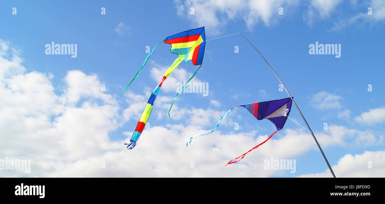 Two kites flying high in the sky Stock Photo - Alamy