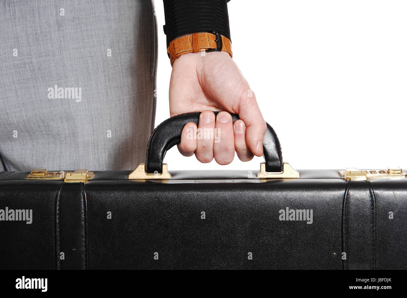 A closeup picture of the hand of a man holding his briefcase, isolated ...