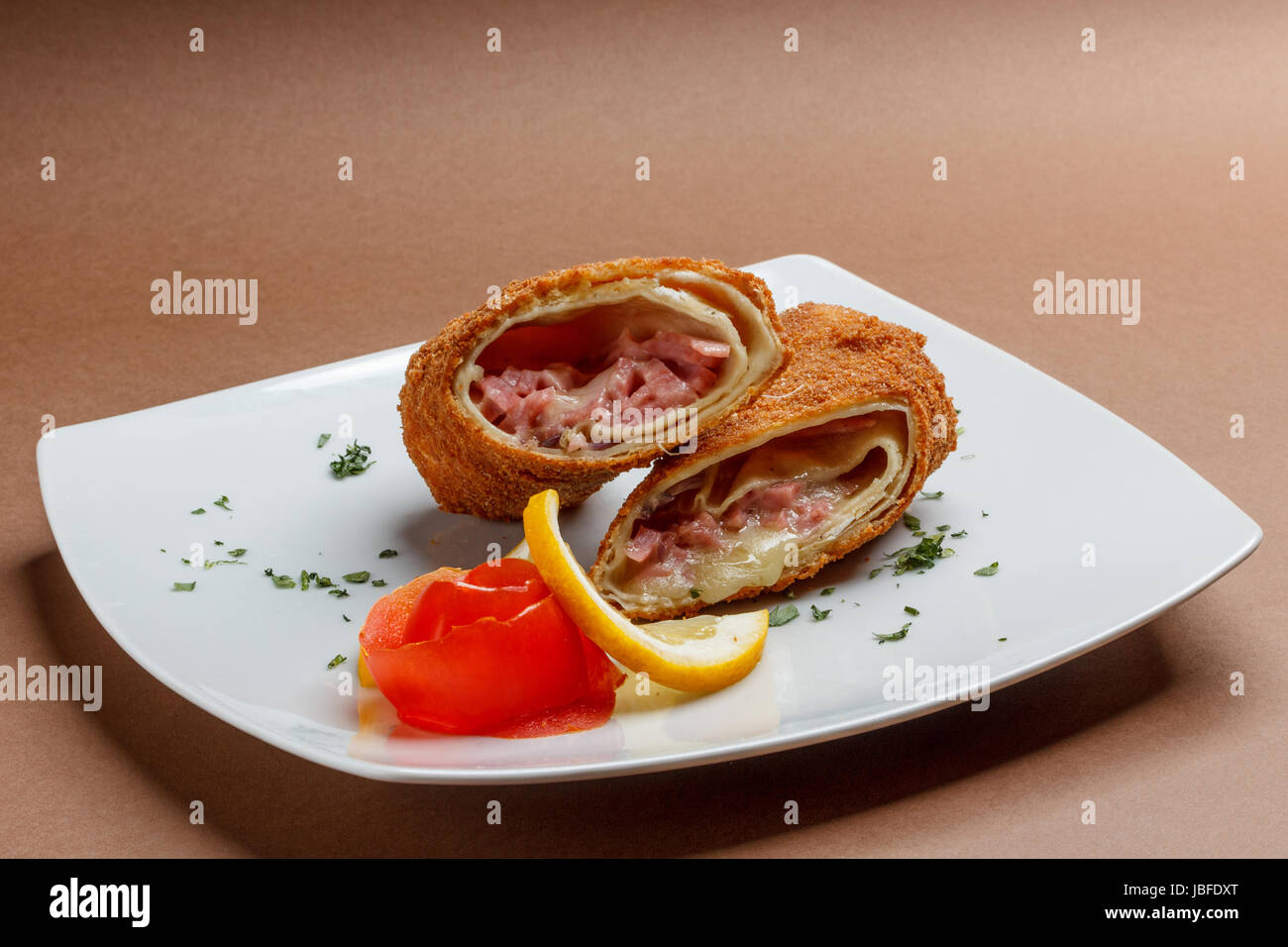 Rolled pancakes stuffed ham and cheese Stock Photo - Alamy