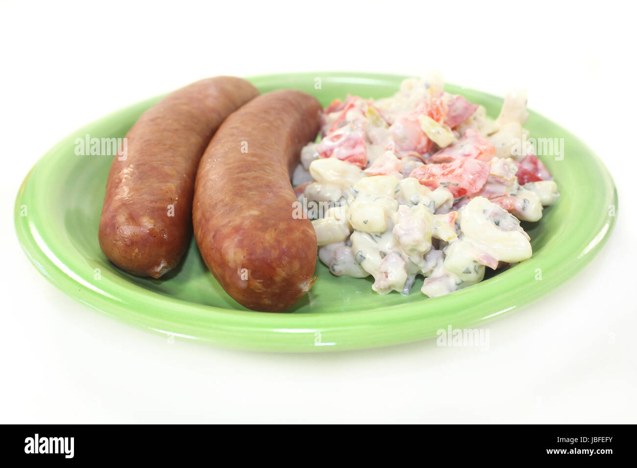 Mettenden mit Nudelsalat vor weißem Hintergrund Stock Photo - Alamy