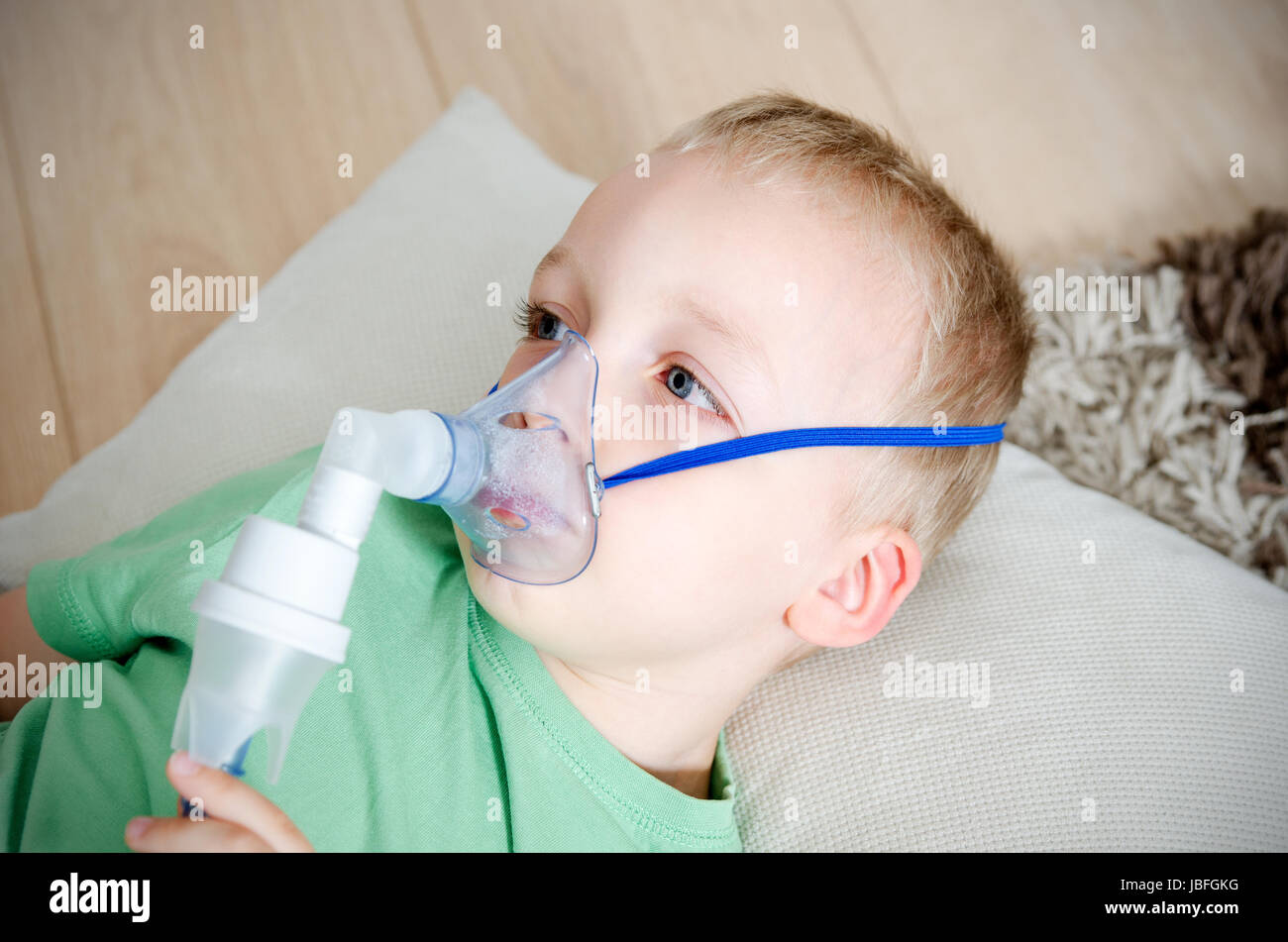 Boy making inhalation with nebulizer at home. child asthma inhaler ...