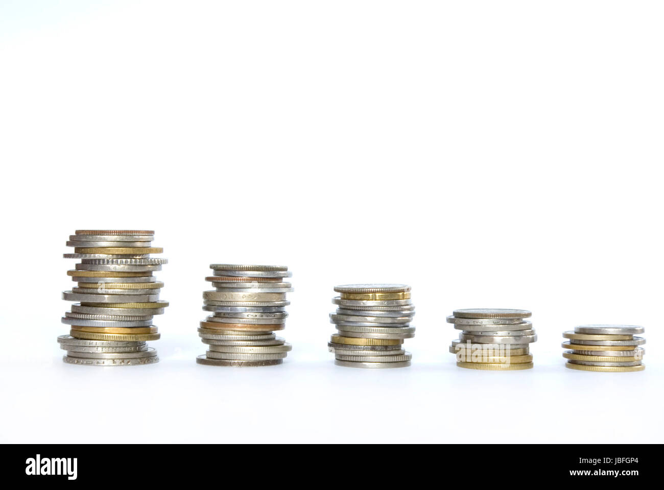 Coin pile isolated on white background Stock Photo - Alamy