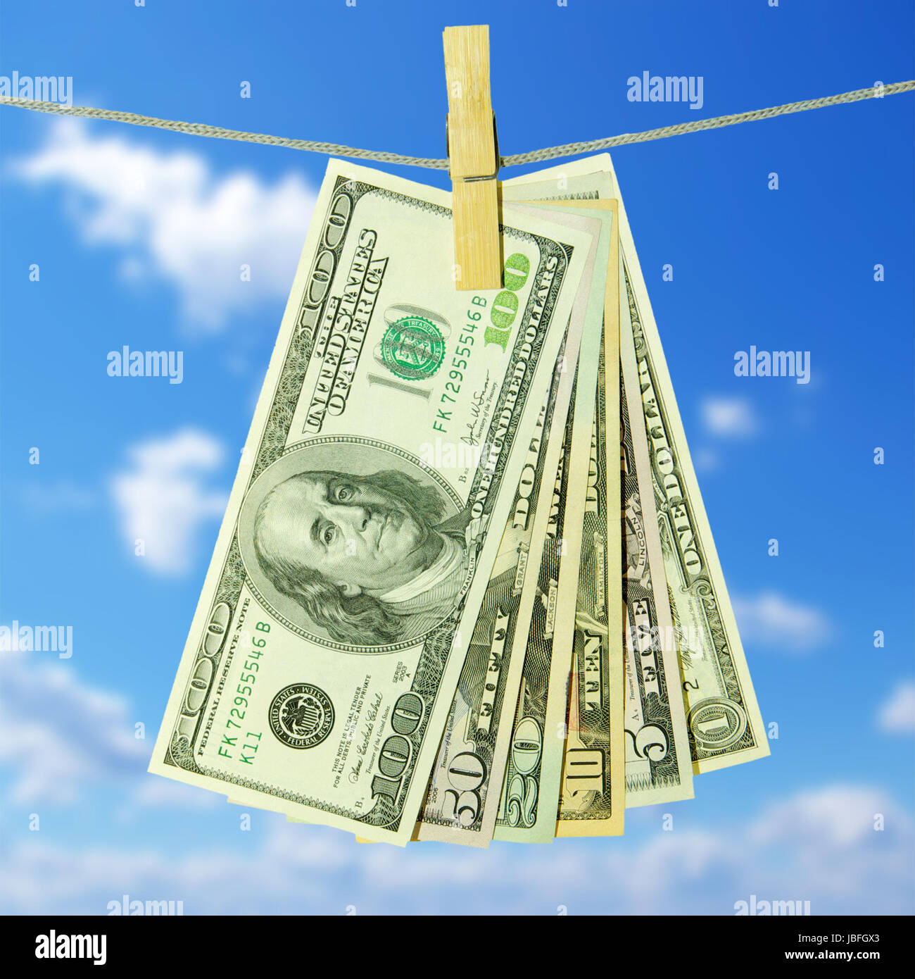 money hanging on a rope over sky Stock Photo - Alamy