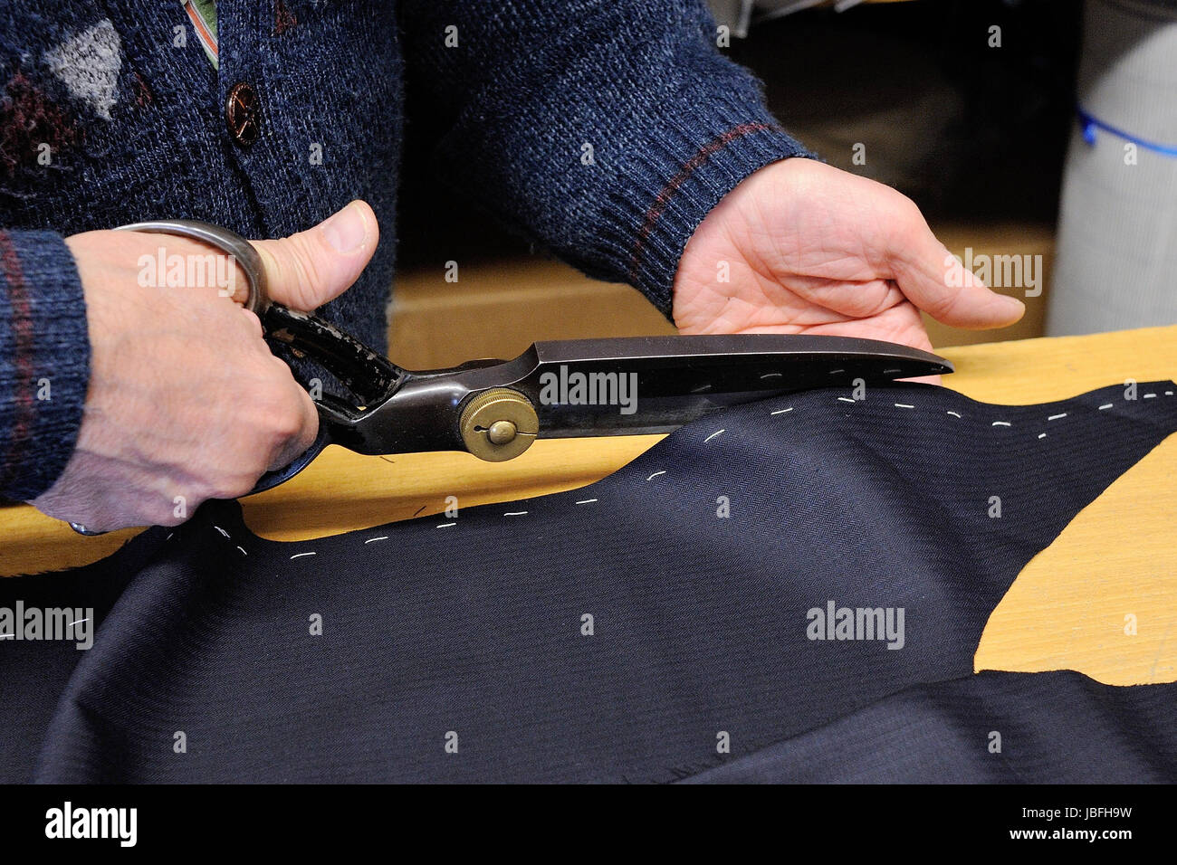 Handwork of bespoke suit, made by traditional tailoring of Sardinia ...