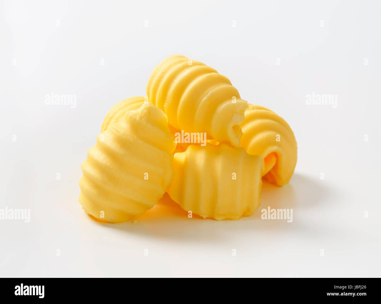 Studio shot of butter curls Stock Photo - Alamy