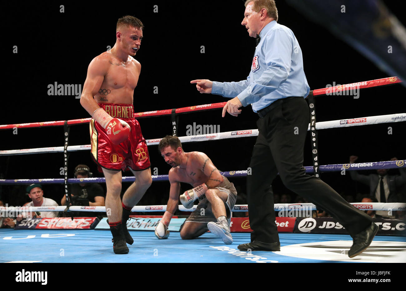 Ryan Burnett is ordered back to his corner by referee Howard Foster ...