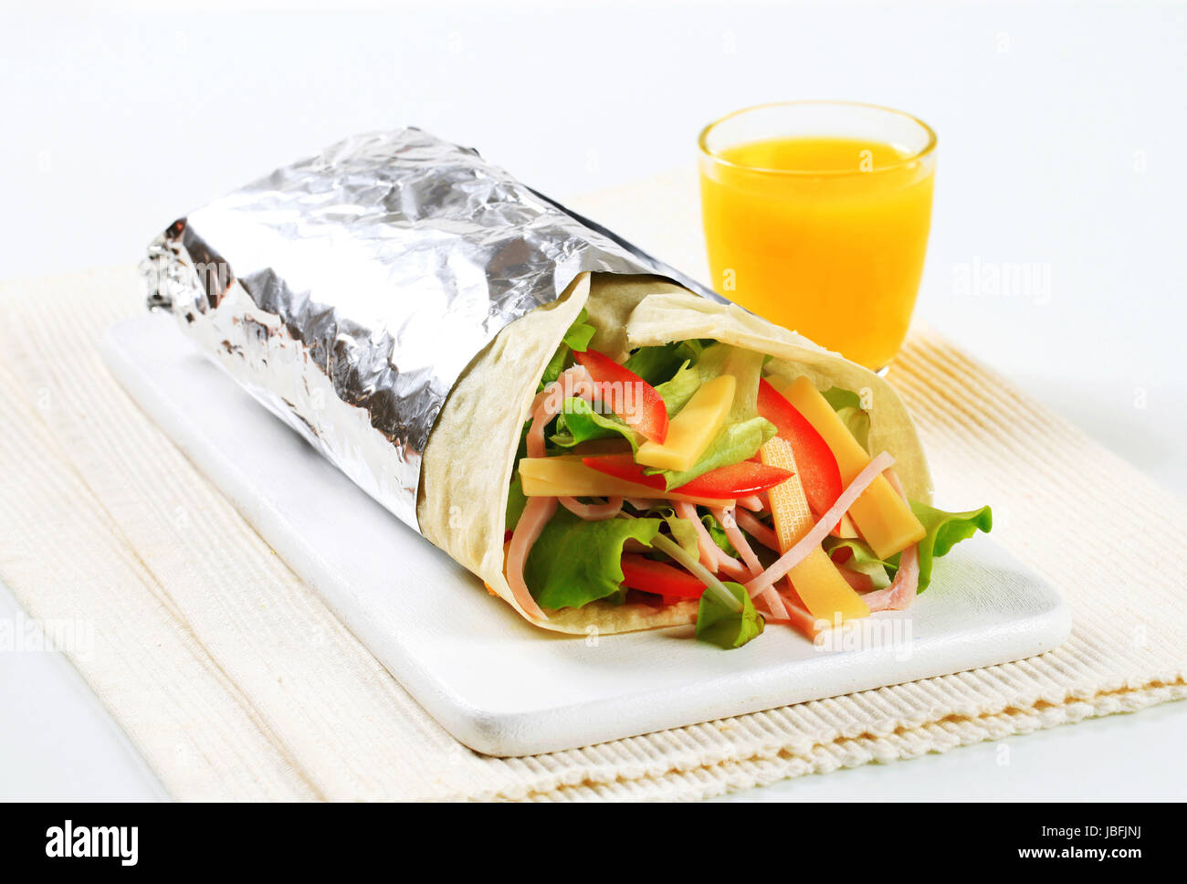 Easy ham and cheese salad wrap sandwich Stock Photo - Alamy