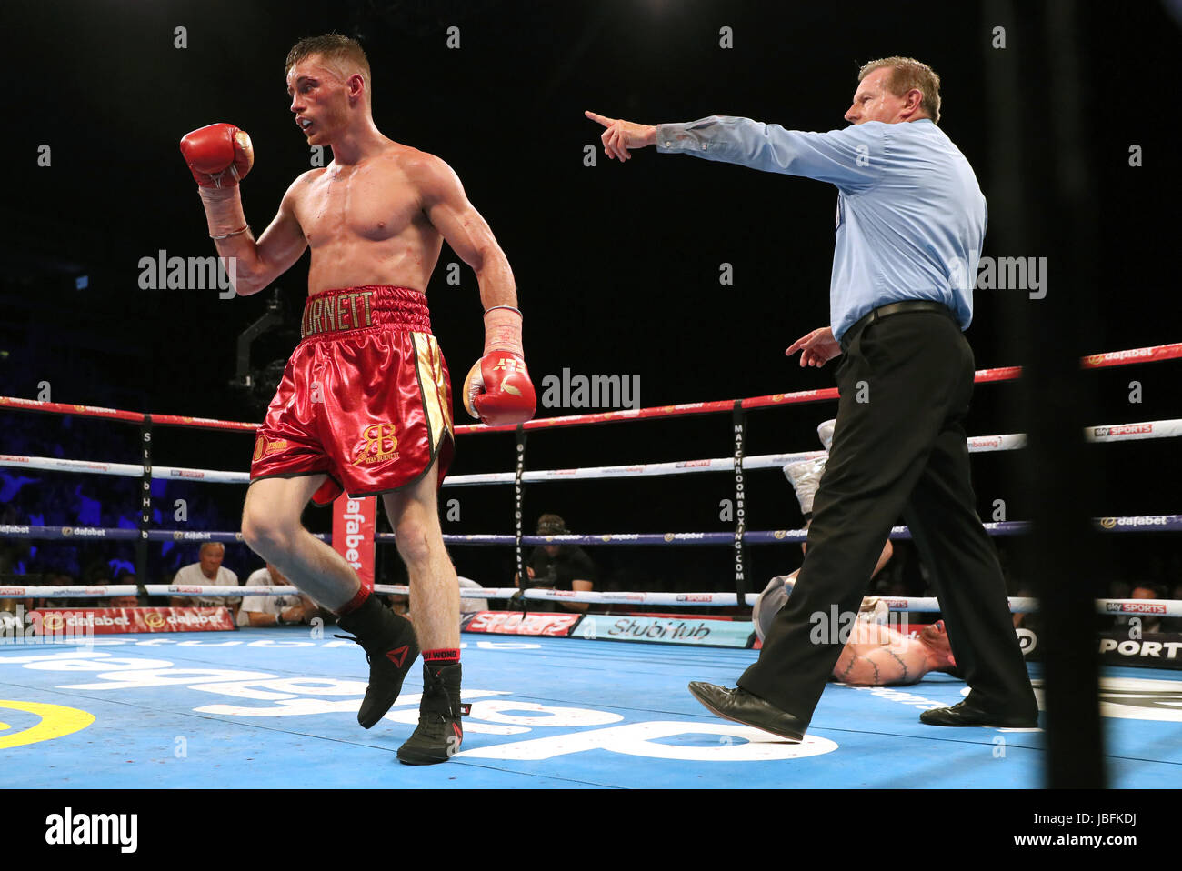 Ryan Burnett is ordered back to his corner by referee Marcus McDonnell after knocking down Lee ...
