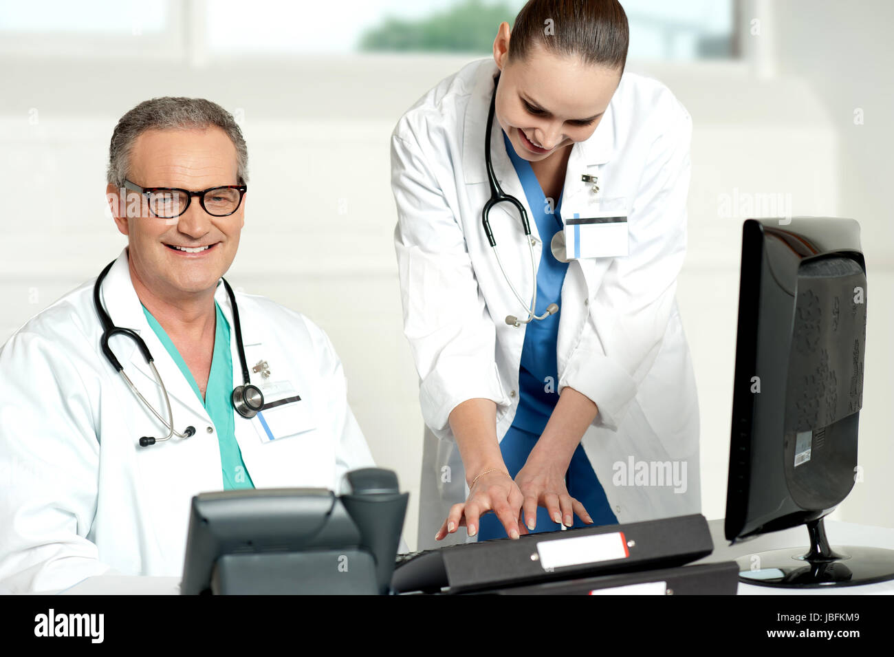 Two cheerful medical experts at hospital Stock Photo - Alamy