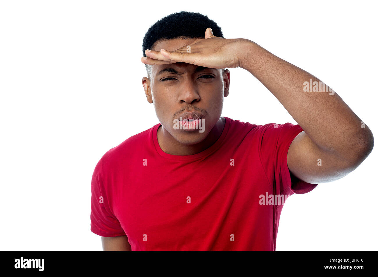 Casual guy watching something closely Stock Photo - Alamy