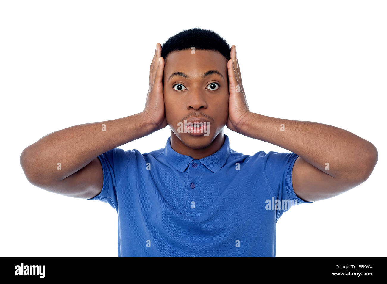 Shocked young man looking at camera Stock Photo - Alamy