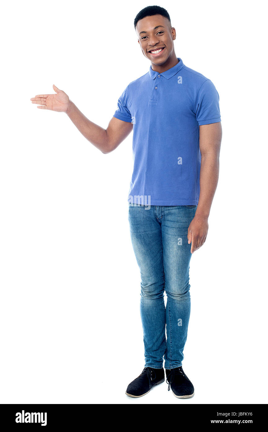 Handsome young smiling man - Welcome gesture Stock Photo - Alamy