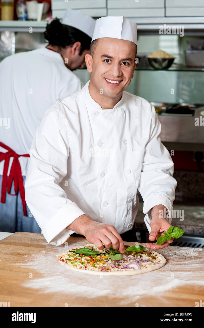 Two young chefs at work. Behind the scenes Stock Photo - Alamy