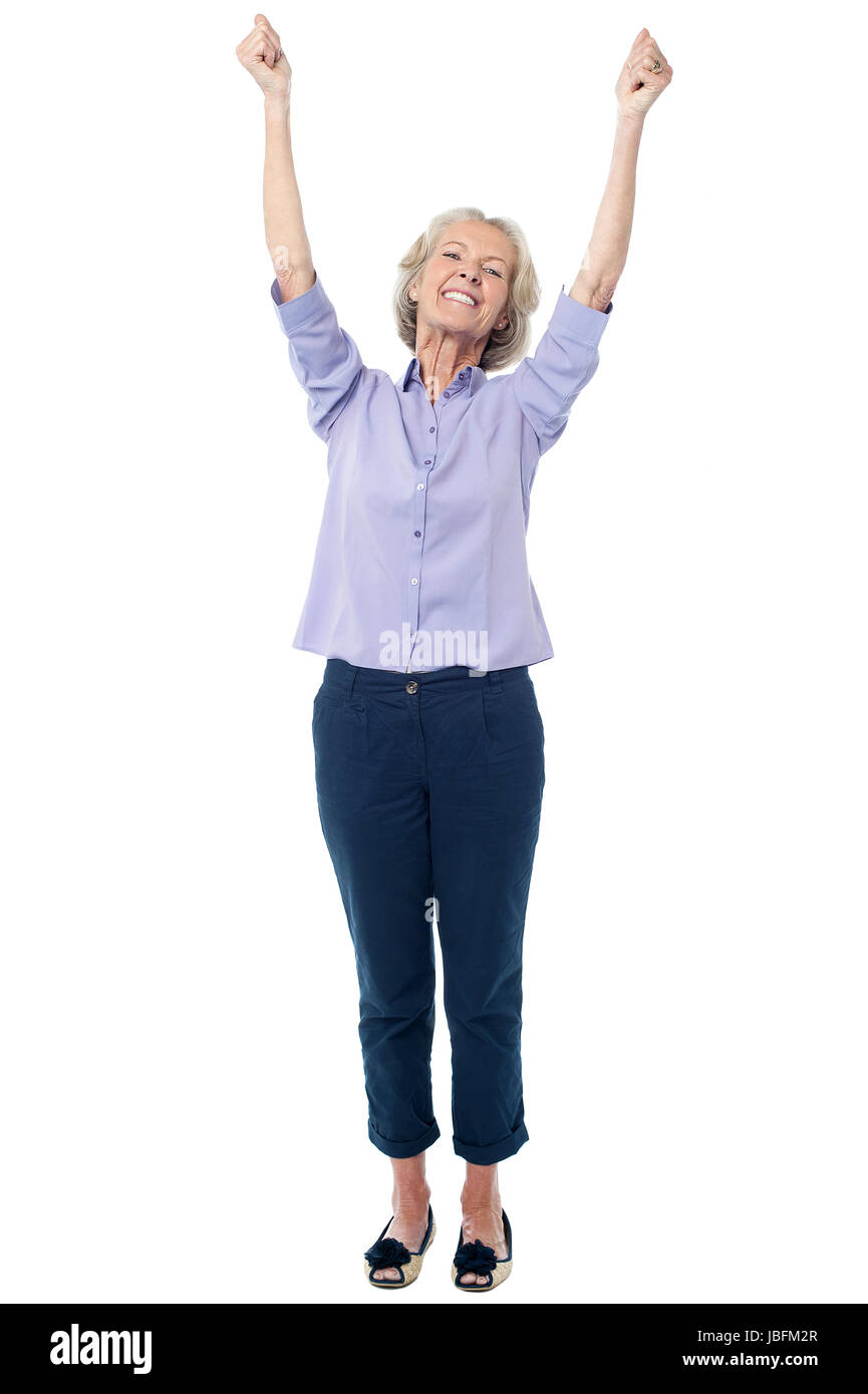 Excited senior citizen raising her hands Stock Photo - Alamy