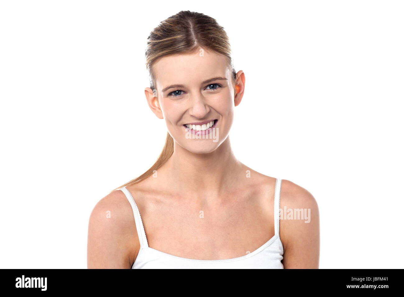 Pretty young girl smiling warmly posing against white Stock Photo - Alamy