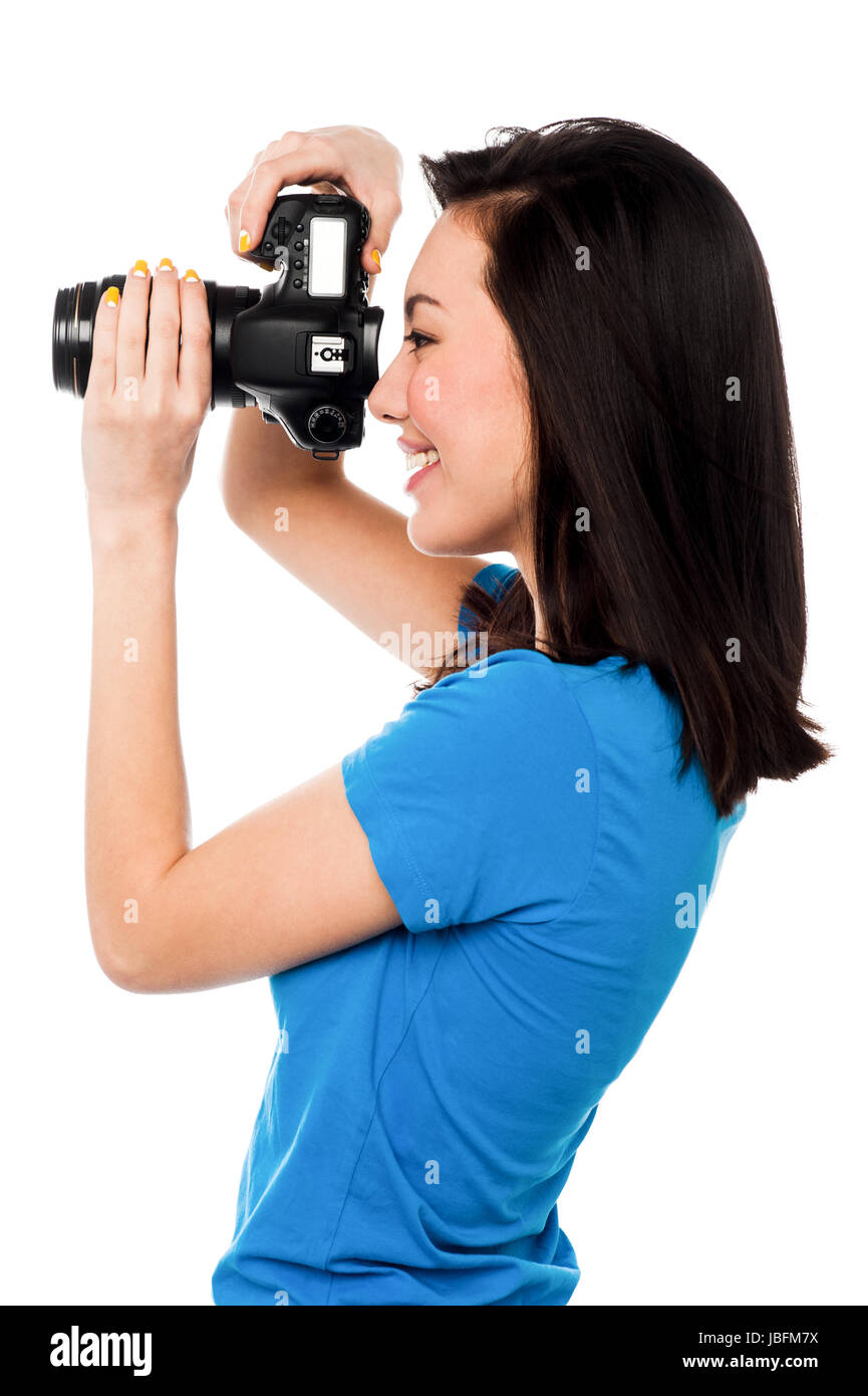 Professional female fashion photographer taking a snapshot Stock Photo ...