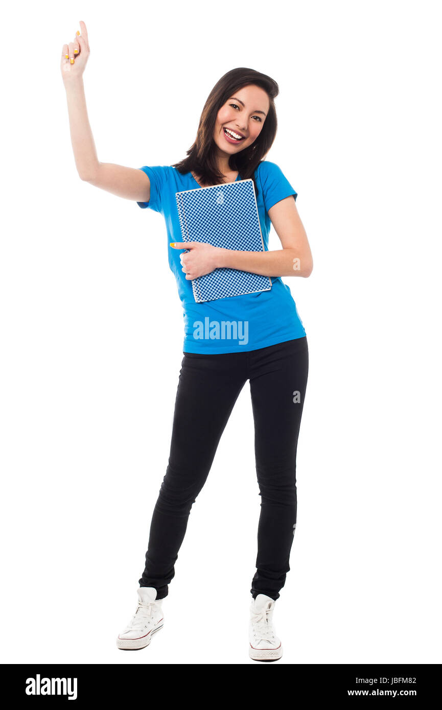 Female student raising her arm up and holding notebook Stock Photo - Alamy