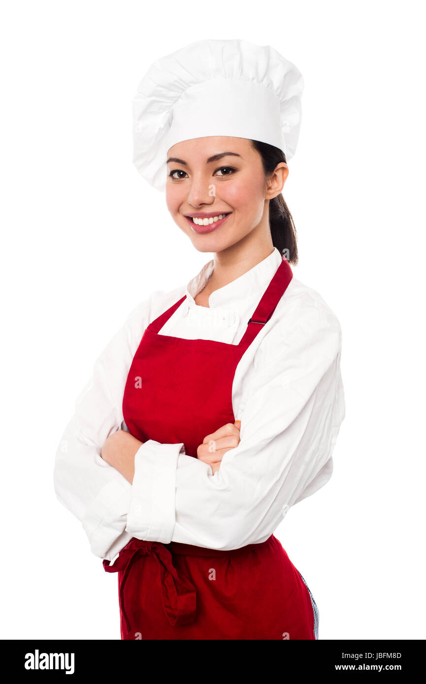 Pretty baker woman posing with confidence, arms folded Stock Photo - Alamy