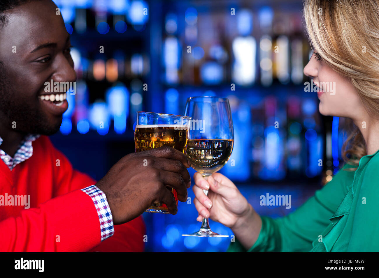 Young romantic couple enjoying cocktails in nightclub Stock Photo - Alamy