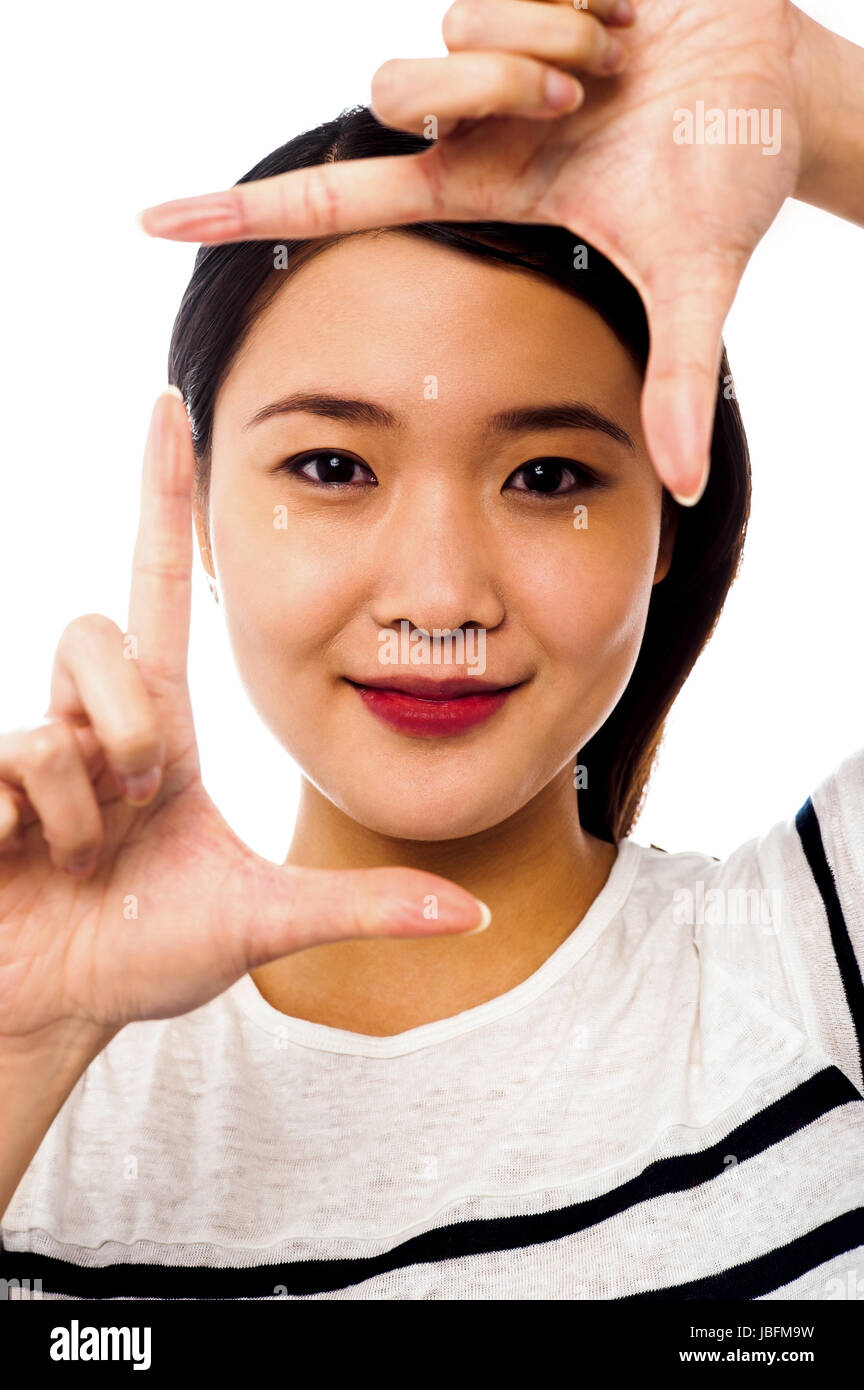 Beautiful woman making frame with hands Stock Photo - Alamy