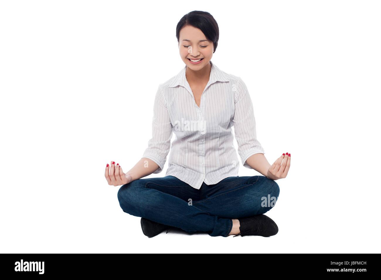 Cheerful woman in lotus posture Stock Photo - Alamy