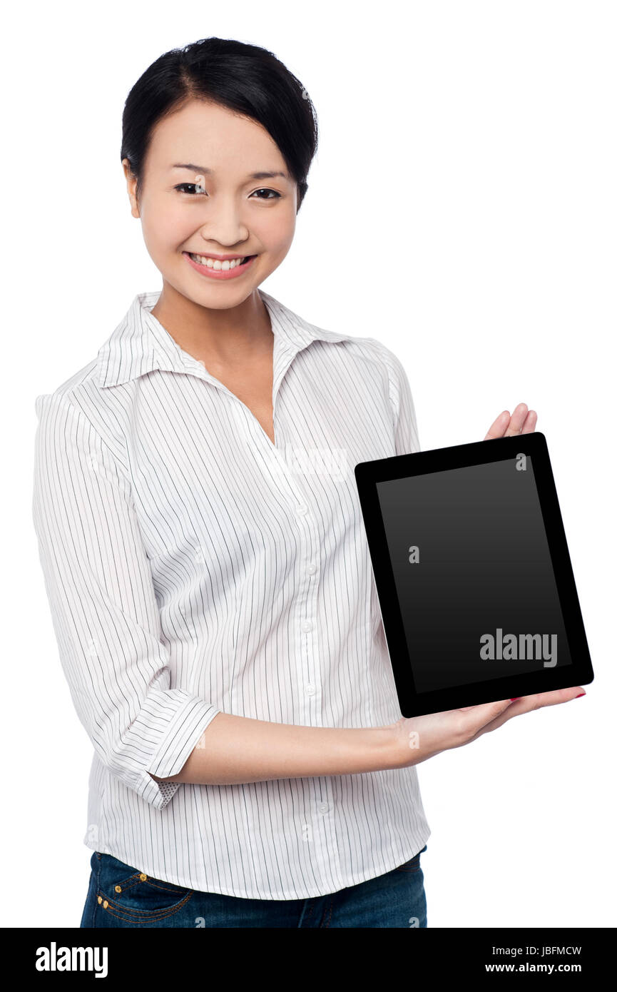 Pretty sales girl presenting the tablet device for sale Stock Photo - Alamy