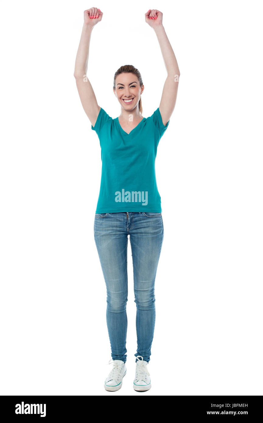 Full length image of young woman raising her hands Stock Photo - Alamy