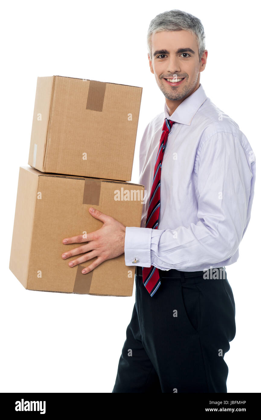 Middle aged man holding stack of parcel boxes Stock Photo - Alamy