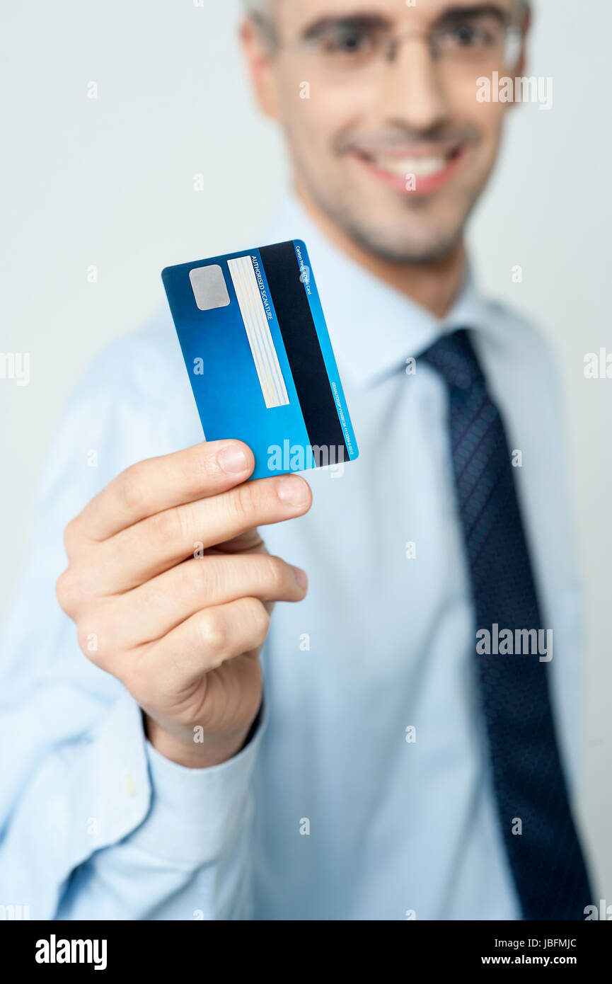Senior corporate guy showing his credit card Stock Photo - Alamy