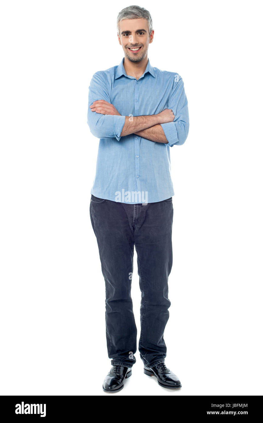 Full length picture of a casual senior man, arms folded Stock Photo - Alamy