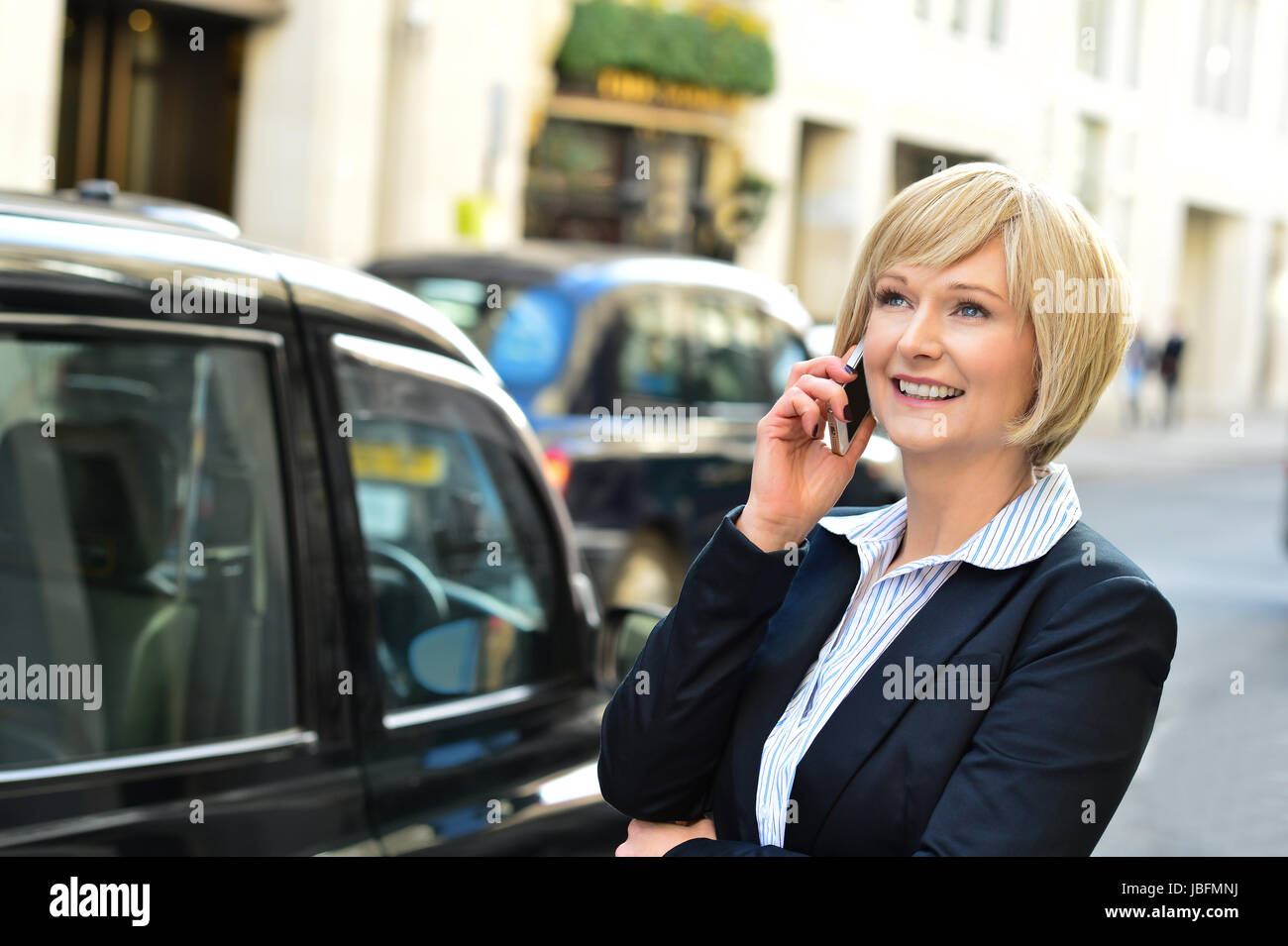 Business lady attending phone call Stock Photo - Alamy