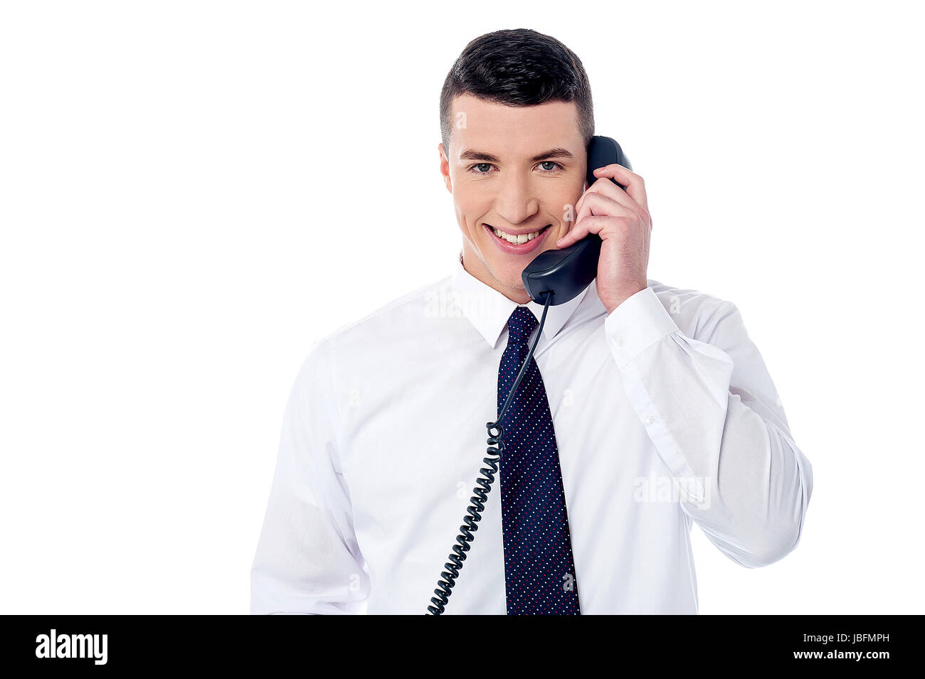 Handsome male executive attending phone call Stock Photo - Alamy